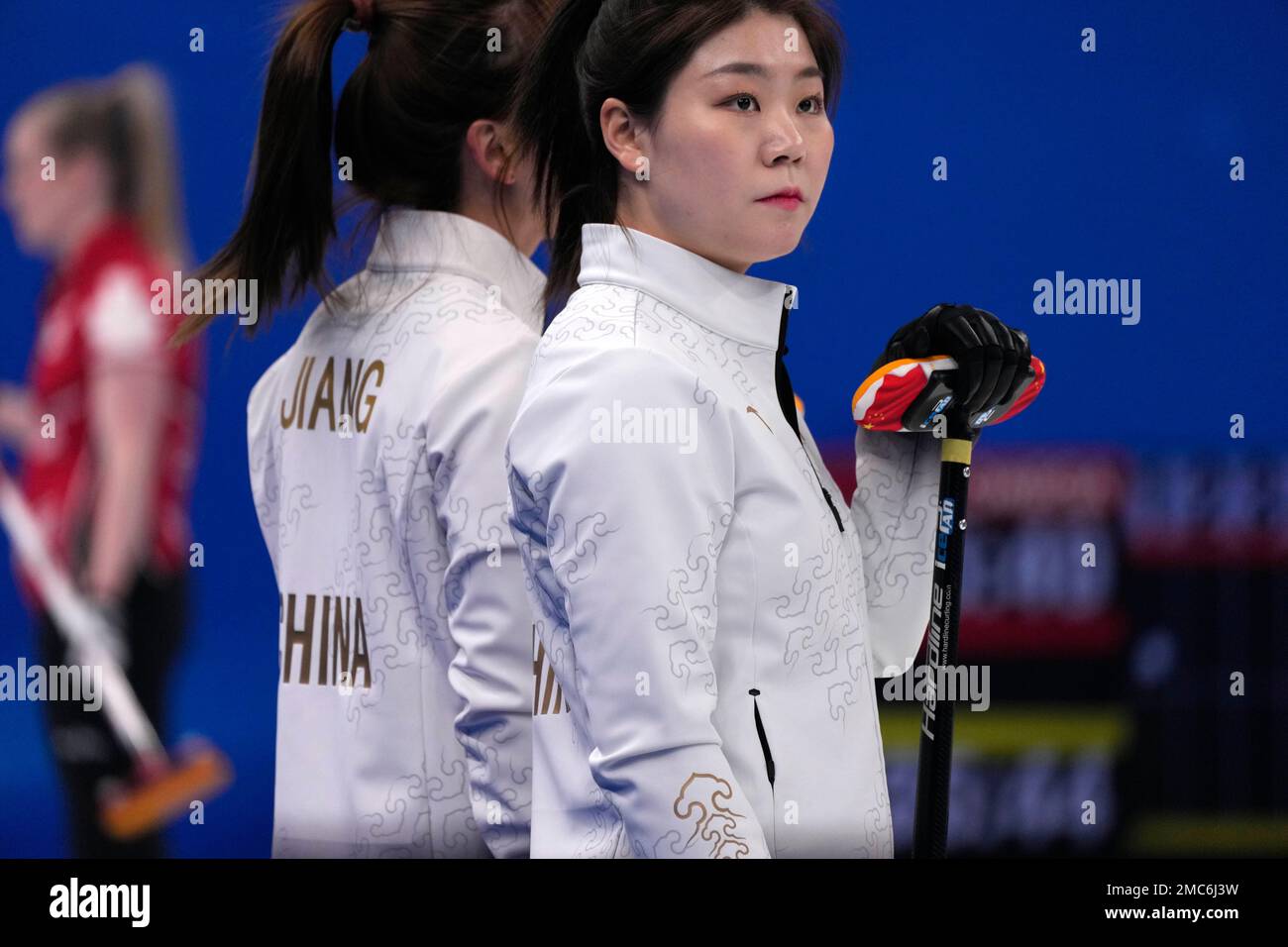 China's Dong Ziqi, competes, during the women's curling match against ...