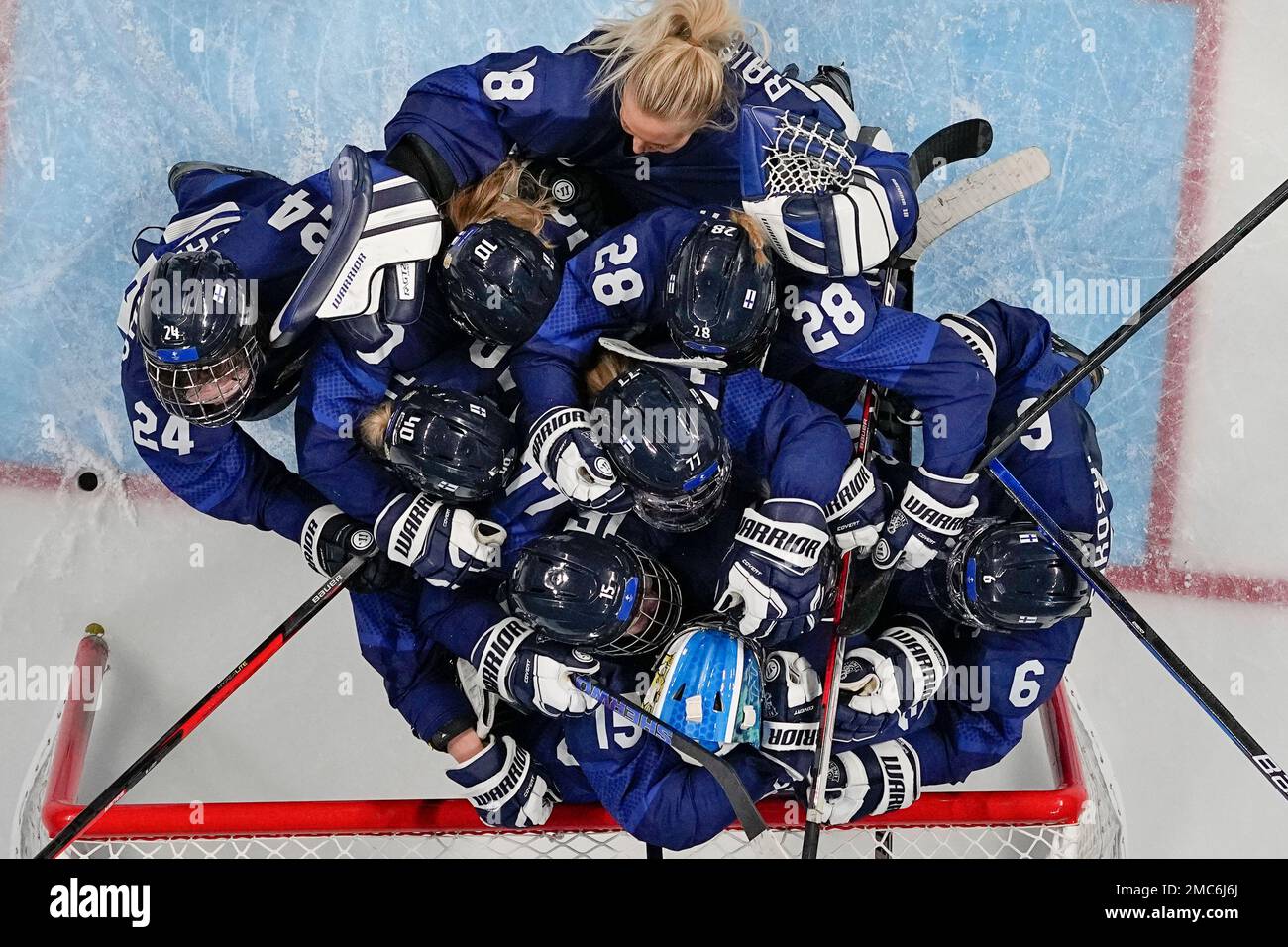 Team Finland Players Mob Goalkeeper Anni Keisala After Beating team-finland-players-mob-goalkeeper-anni-keisala-after-beating