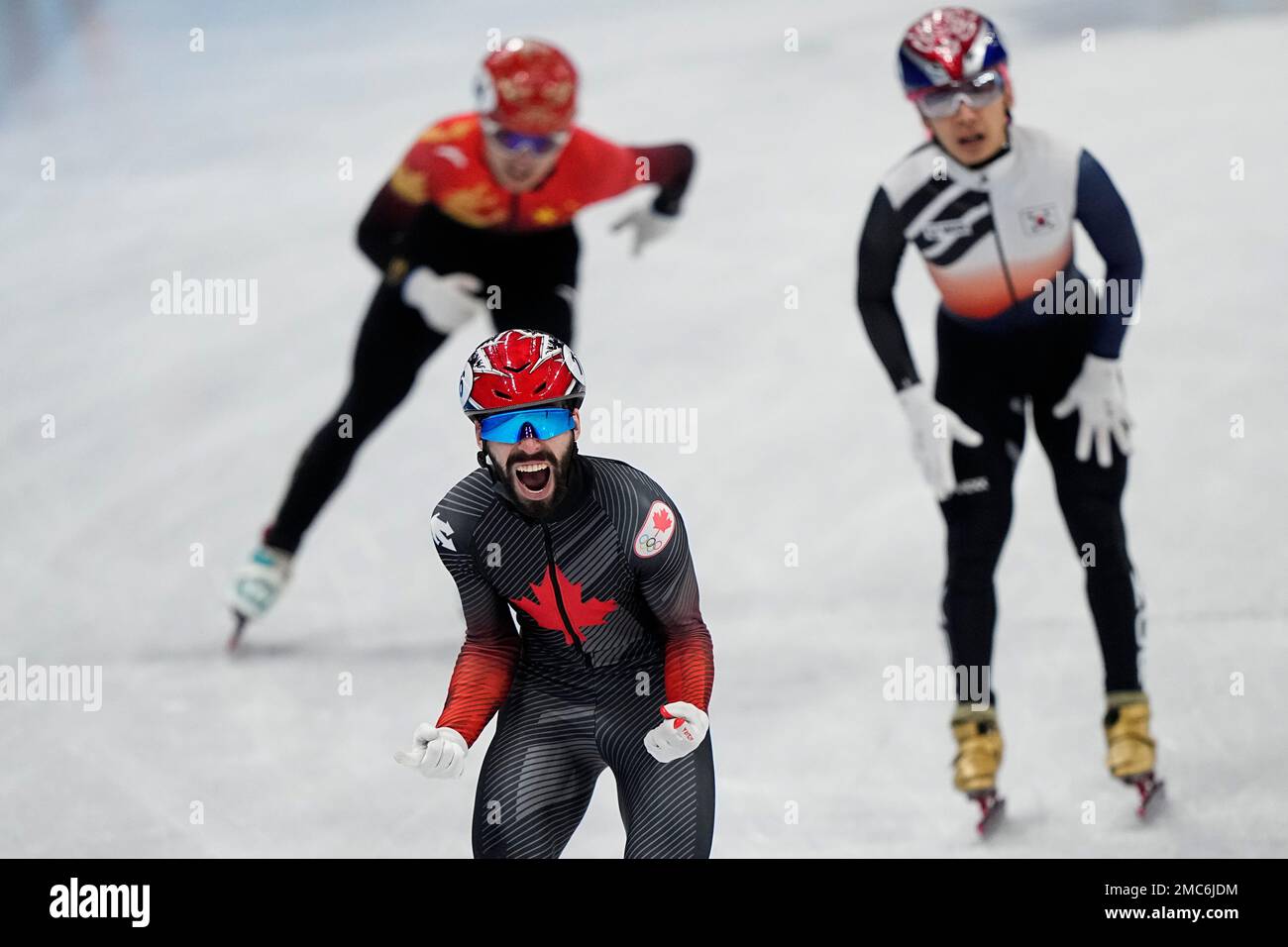 Steven Dubois of team Canada, reacts after winning the men's 5000 ...