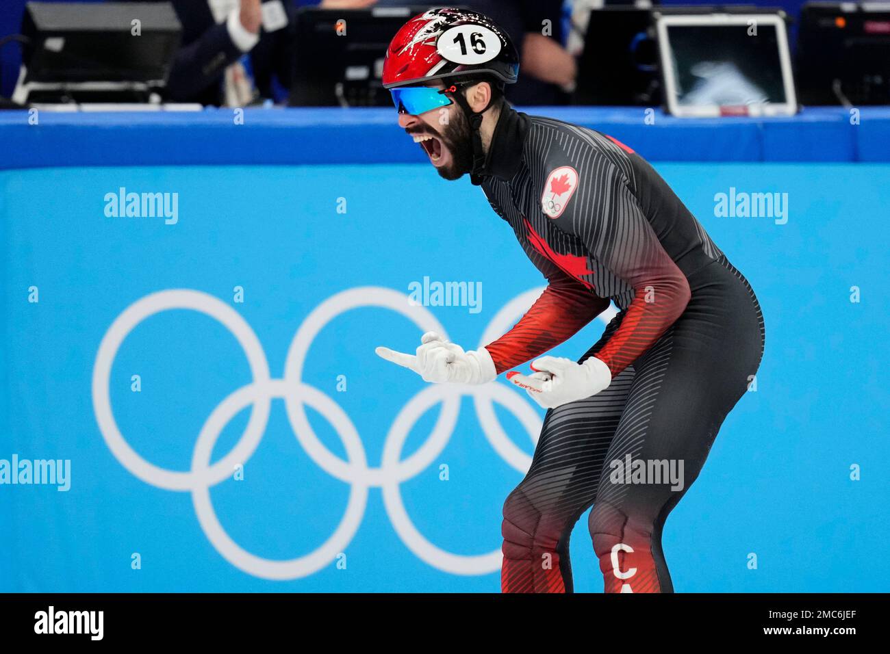 Steven Dubois of team Canada, celebrates after winning the men's 5000 ...