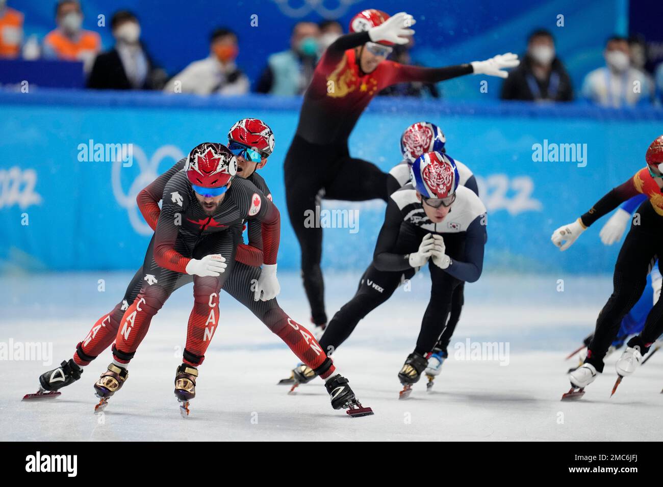 Steven Dubois, left, of team Canada, race in the men's 5000-meters ...