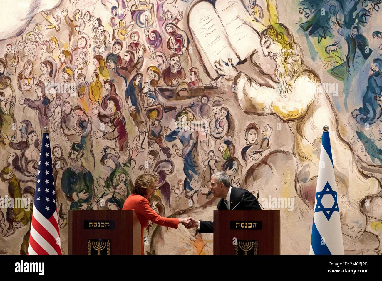 U.S. House Speaker Nancy Pelosi, left, shakes hands with Mickey Levy ...