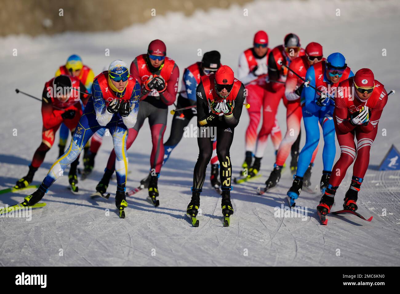 Skiers compete during the men's team sprint classic cross-country ...
