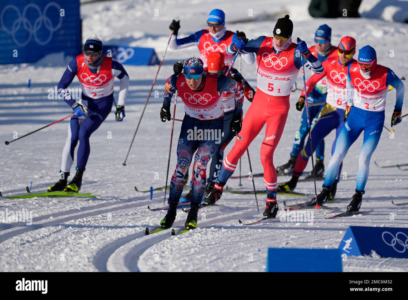 Erik Valnes, of Norway, leads a group during the men's team sprint ...
