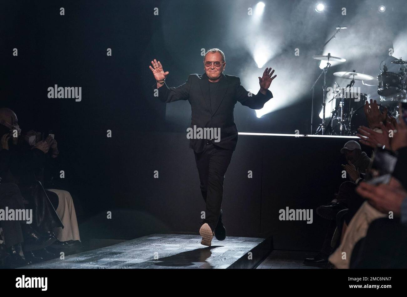 Fashion designer Michael Kors takes the runway to applause after ...