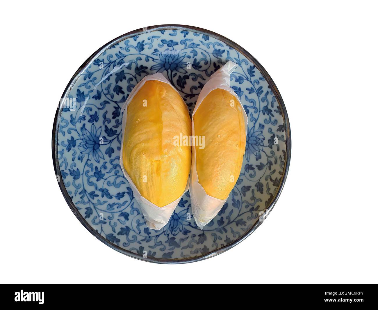 Two of Golden yellow color Durian meat wrapped with white paper on the ...