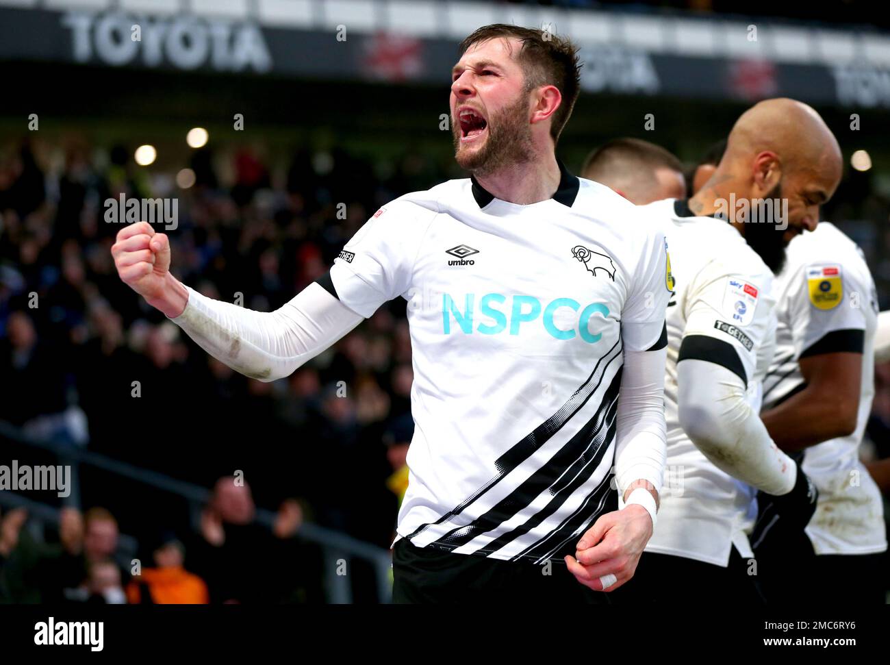 Derby County's Tom Barkhuizen celebrates after team-mate Conor ...