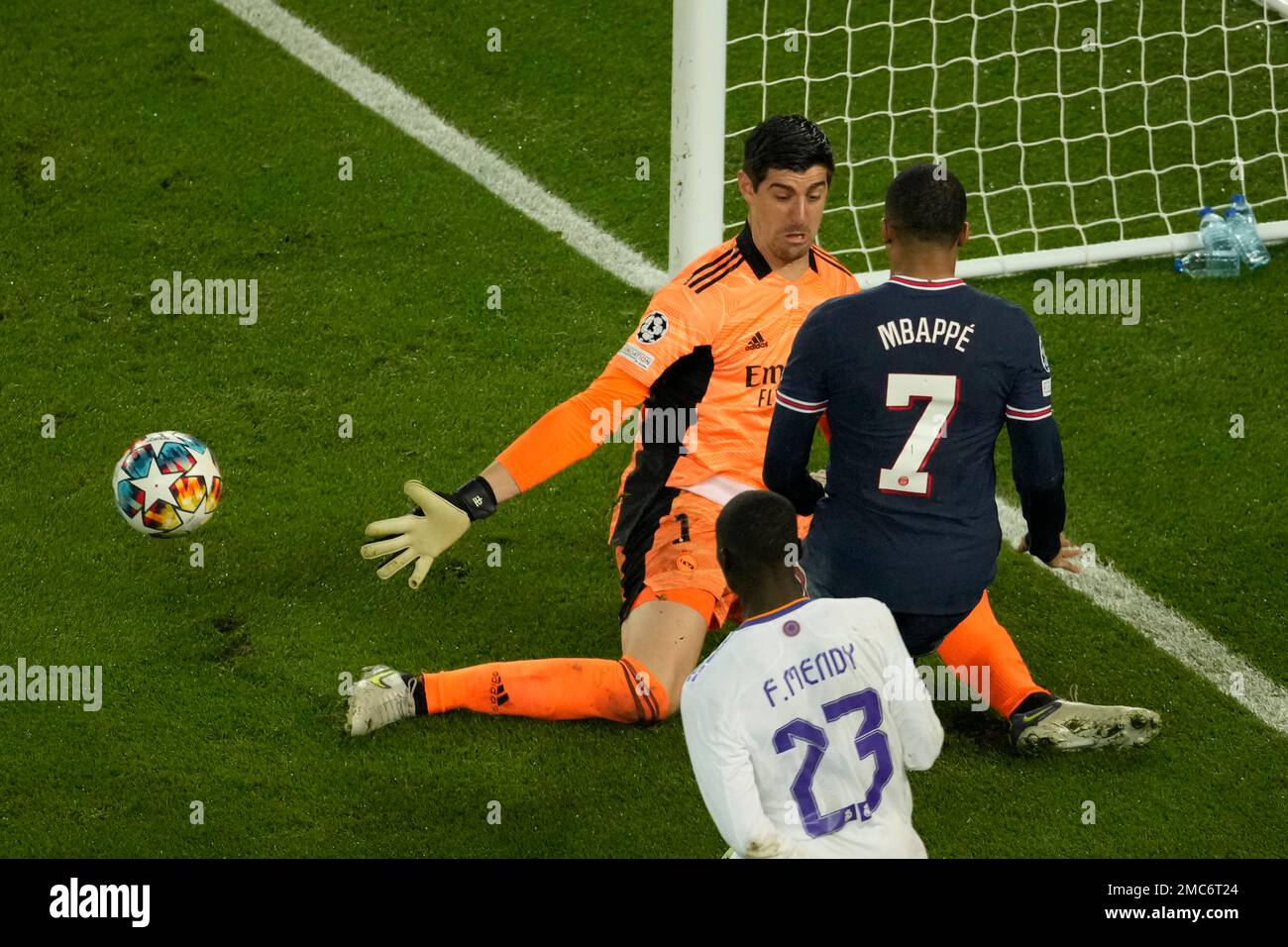 Real Madrid's goalkeeper Thibaut Courtois makes a save in front PSG's ...