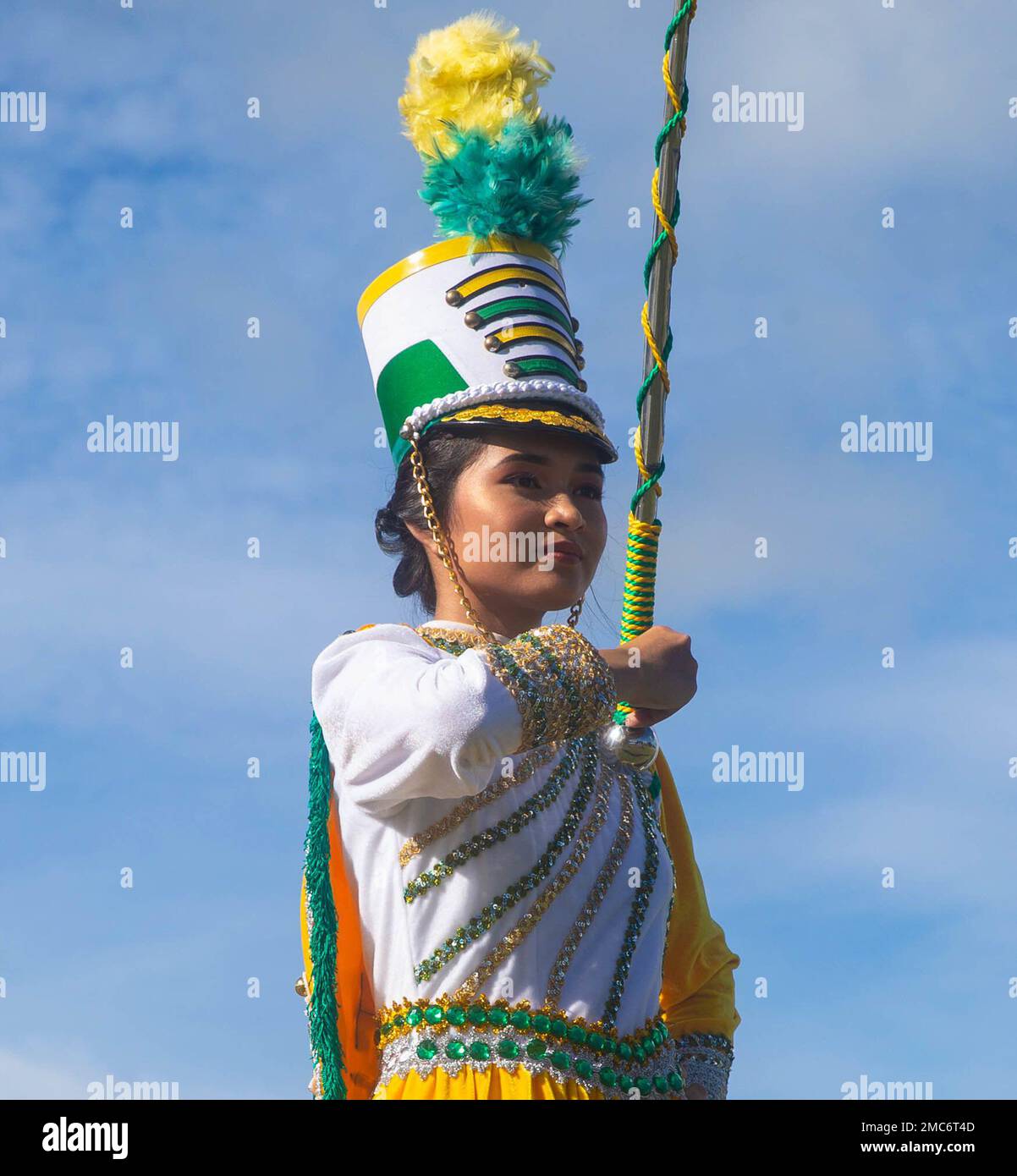 A local high school student poses for a portrait before performing in a ...