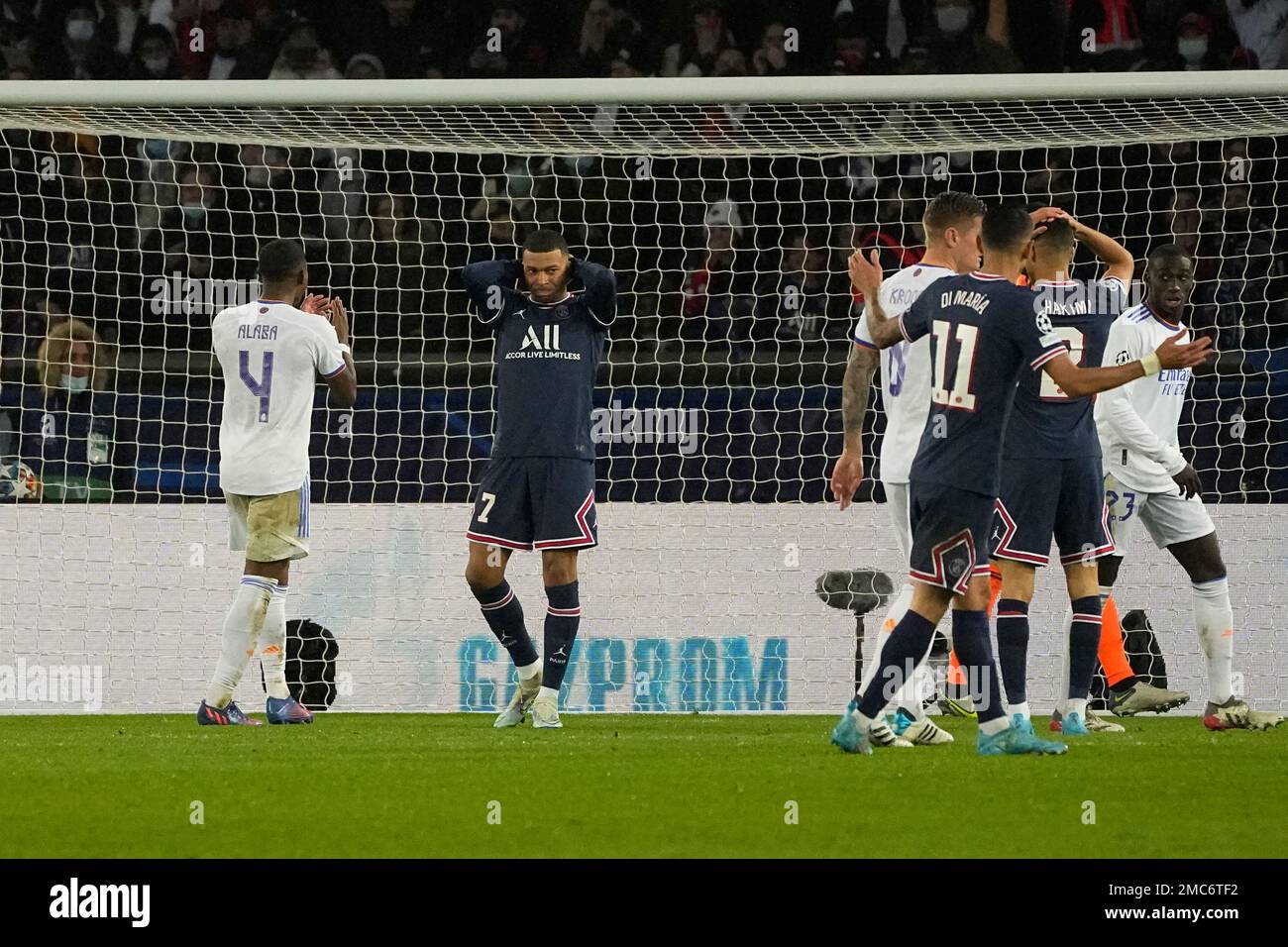 PSG's Kylian Mbappe, center reacts after missing to score during the ...