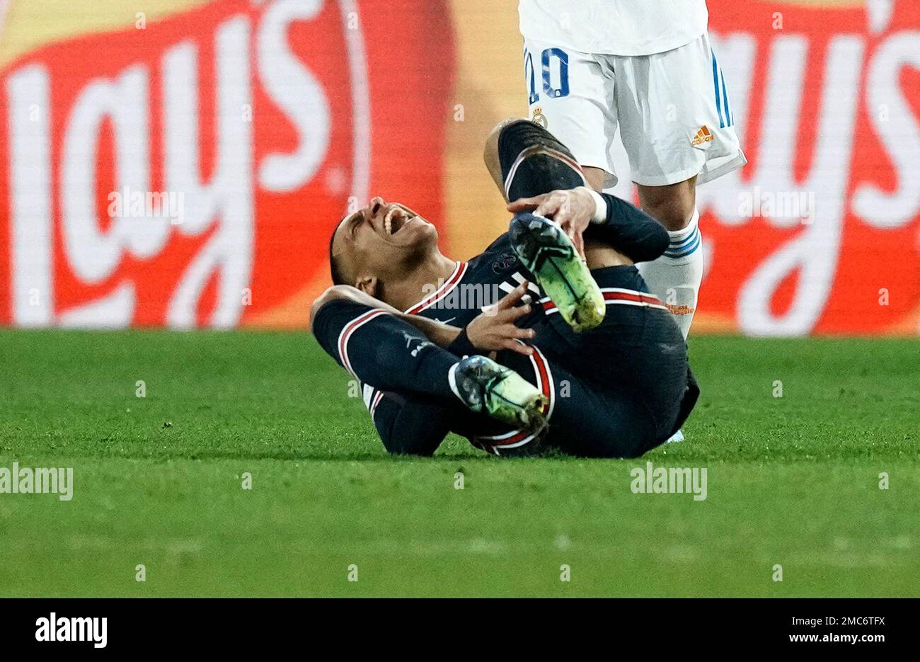 PSG's Kylian Mbappe reacts after sustaining an injury during the ...
