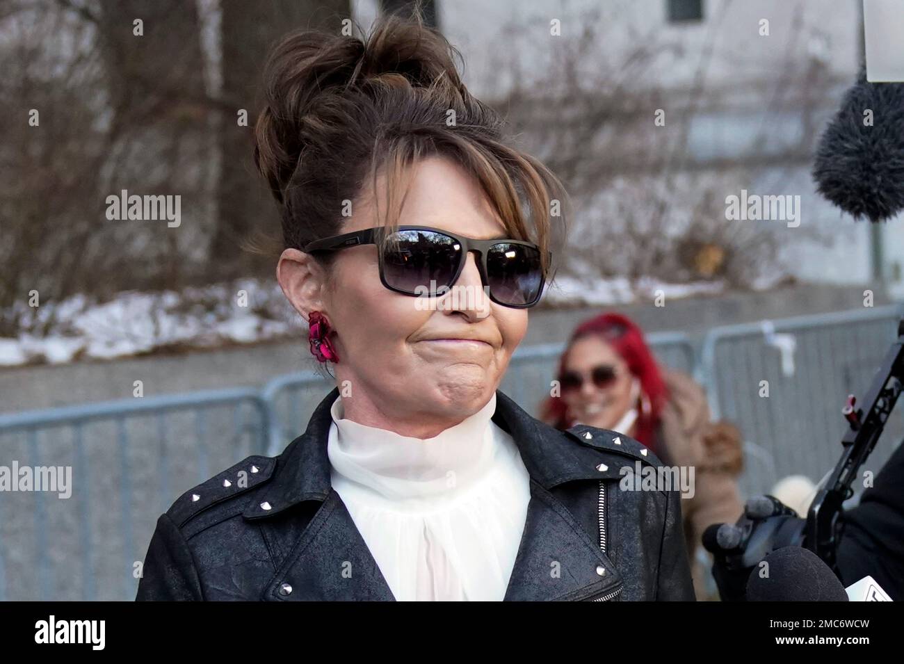 File — Former Alaska Gov Sarah Palin Reacts As She Leaves A Courthouse