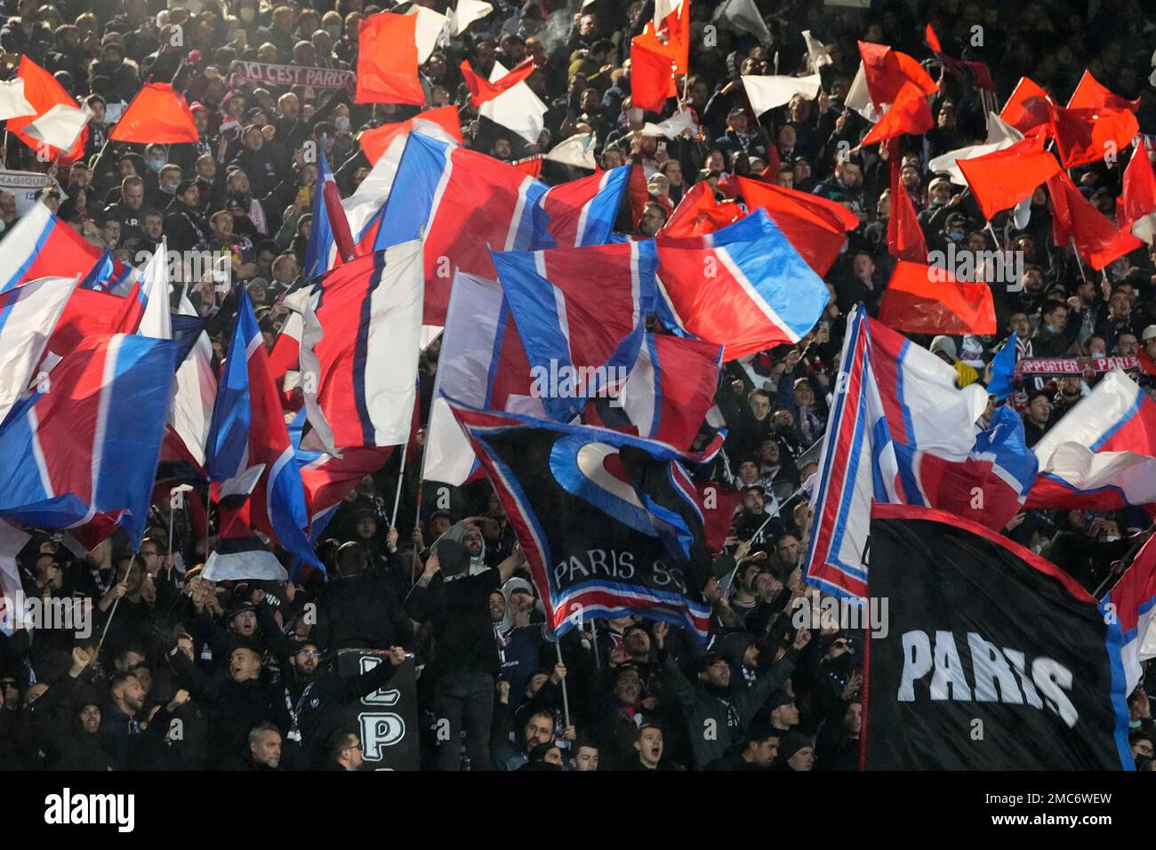 PSG supporters wave flags before the Champions League round of 16 ...
