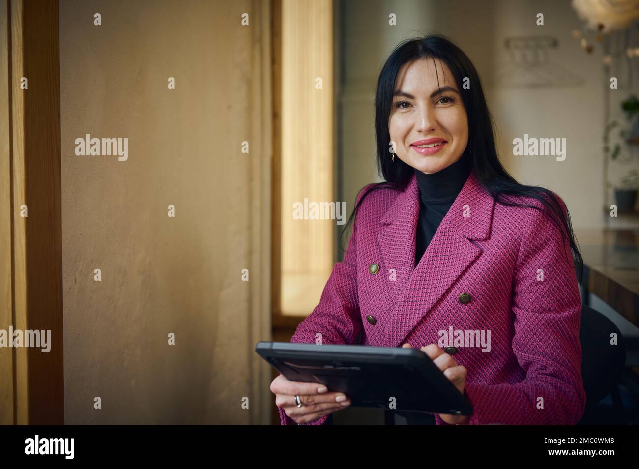 Smiling middle-aged business woman, leader entrepreneur, CEO holding ...