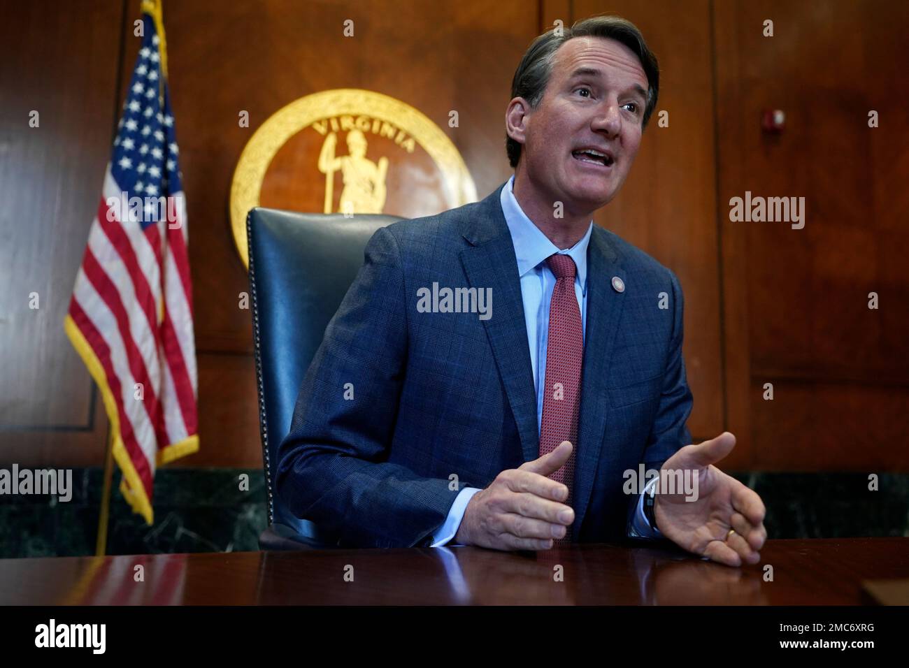 Virginia Gov. Glenn Youngkin, gestures during an interview in his ...
