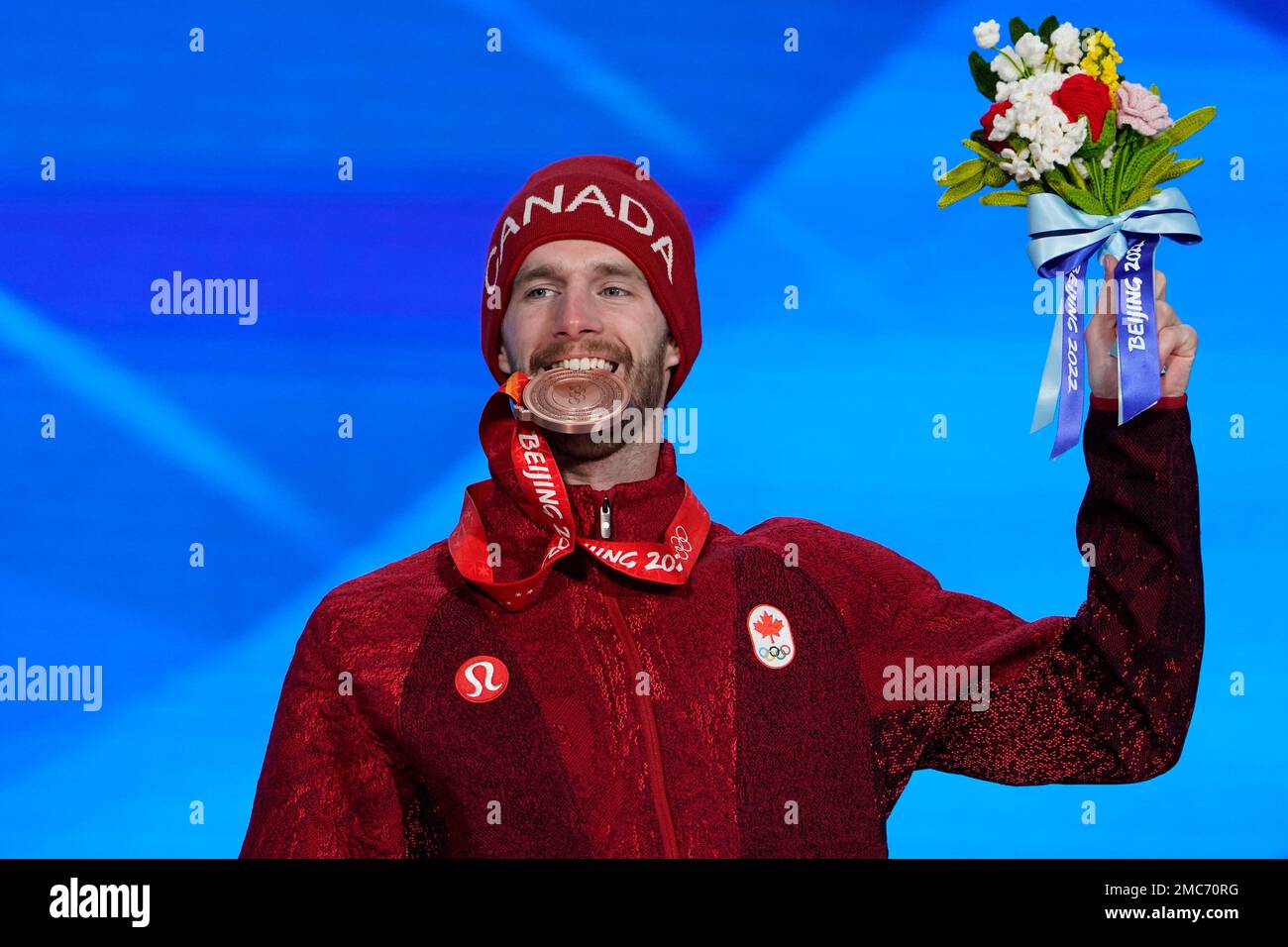 Bronze medalist Max Parrot of Canada celebrates during a medal ceremony ...