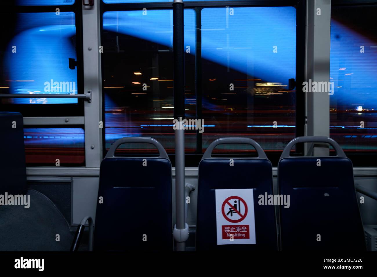 An Olympic shuttle bus passes a sculpture inside the Olympic Park at ...