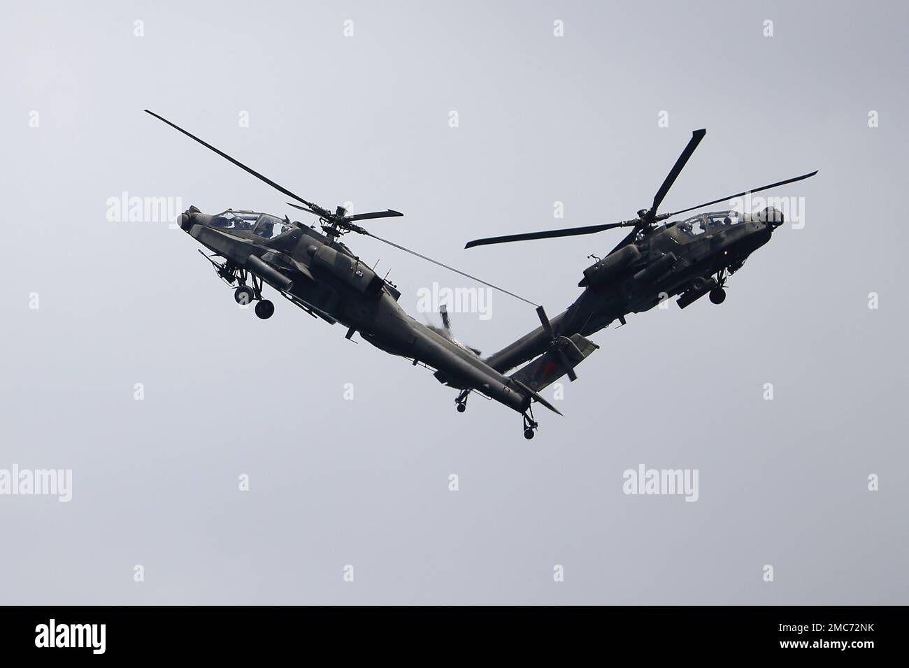 A pair of Republic of Singapore Air Force (RSAF) AH-64D Apache attack ...