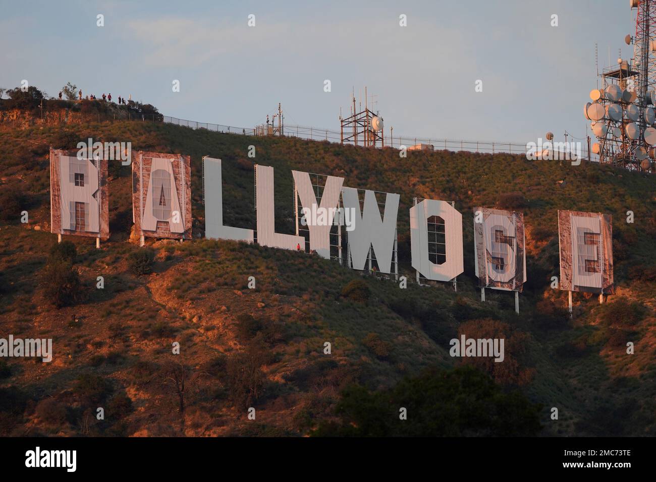 Workers transform the Hollywood sign to read "Rams House" in Los ...