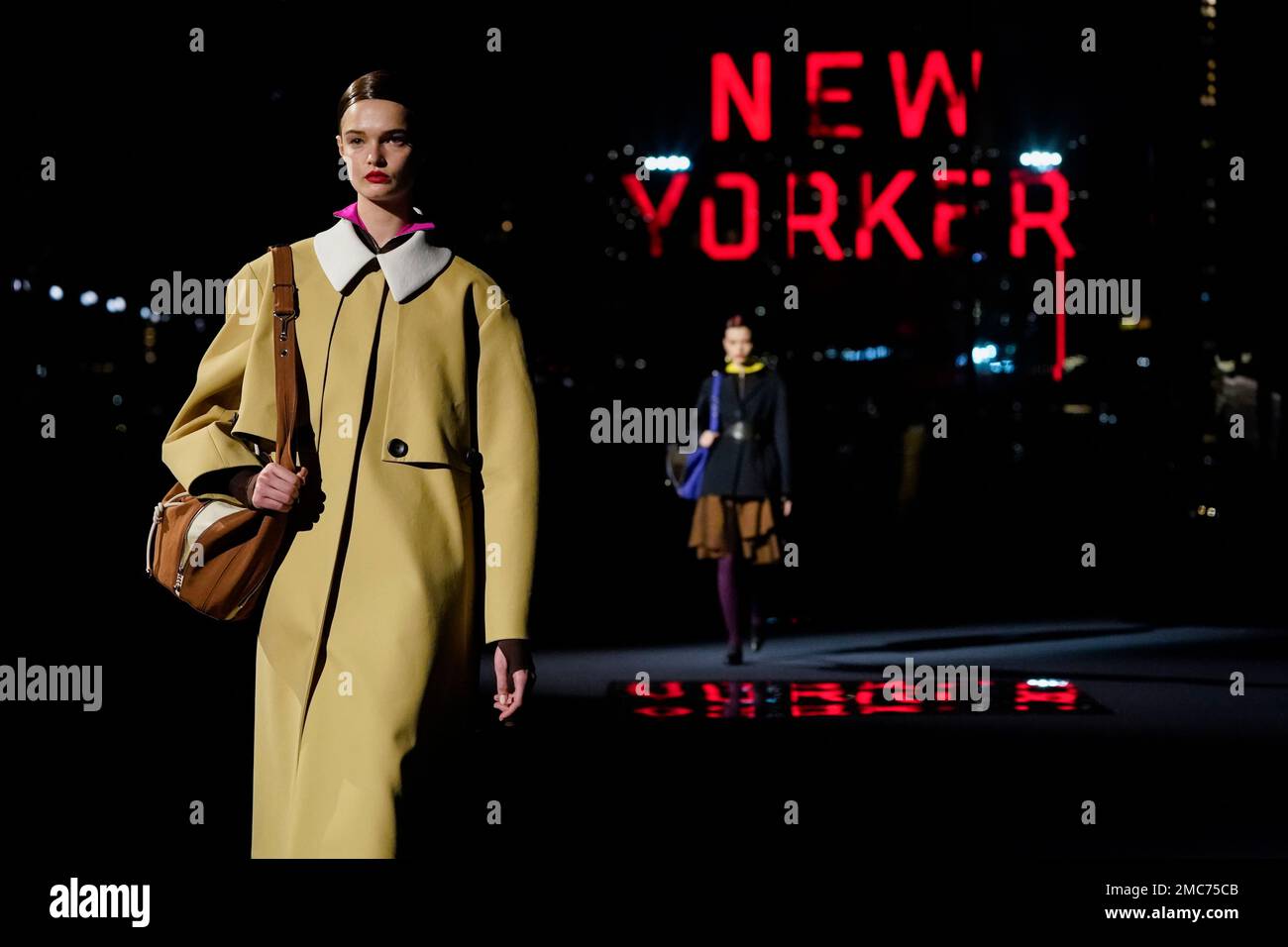 Fashion from the Tory Burch fall/winter 2022 collection is modeled ...