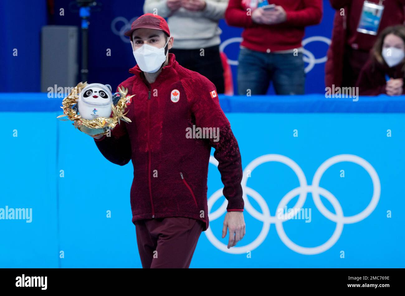 Bronze medalist Steven Dubois of Canada leaves the podium after the ...