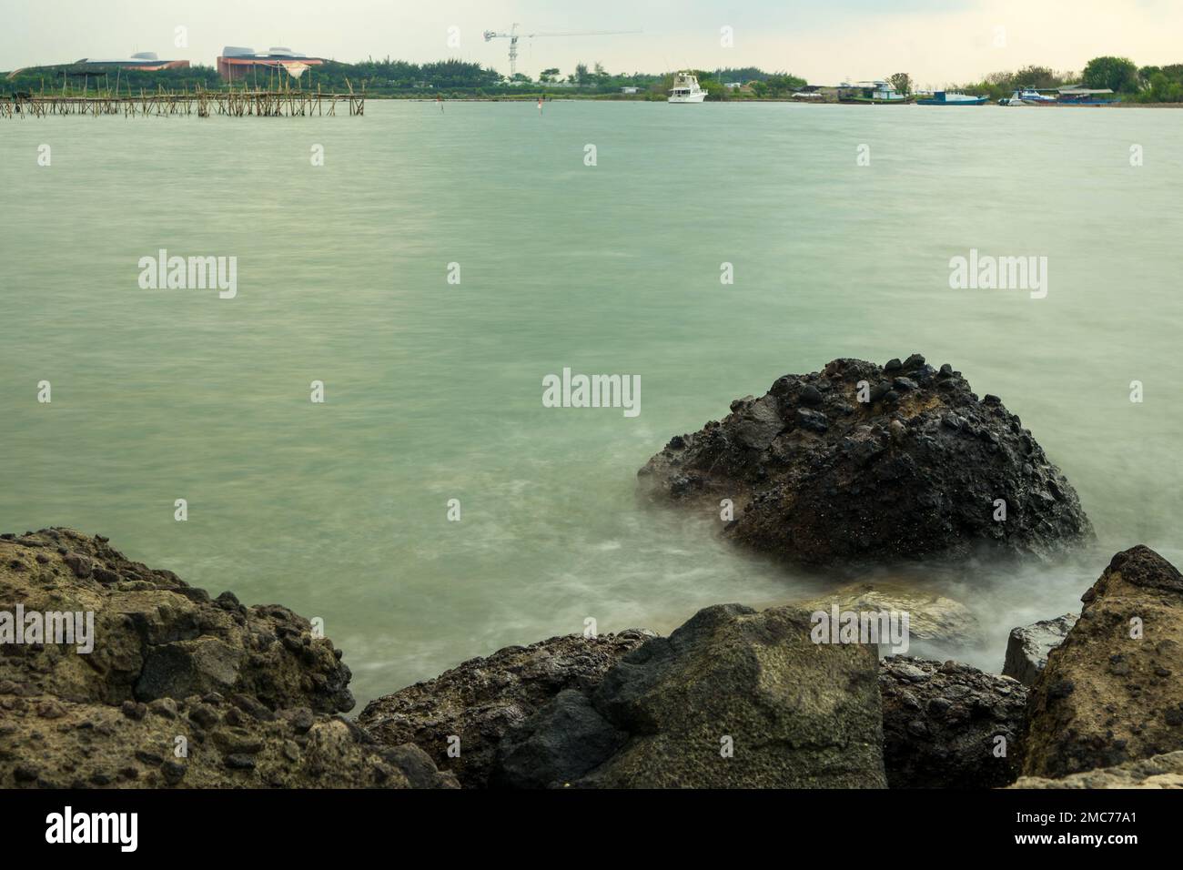 Rocks on the Marina Beach Semarang. Indonesia Stock Photo - Alamy