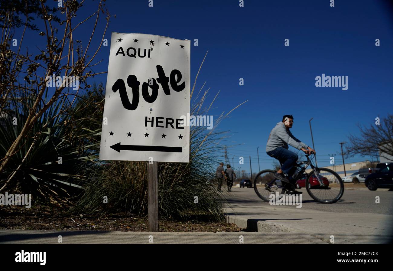 Voters leave an early voting poll site, Monday, Feb. 14, 2022, in San ...