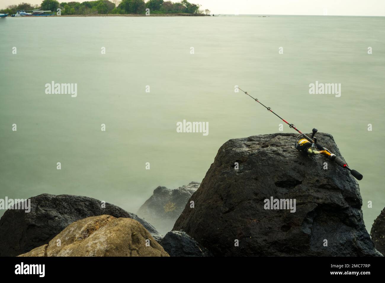 Rocks on the Marina Beach Semarang. Indonesia Stock Photo - Alamy