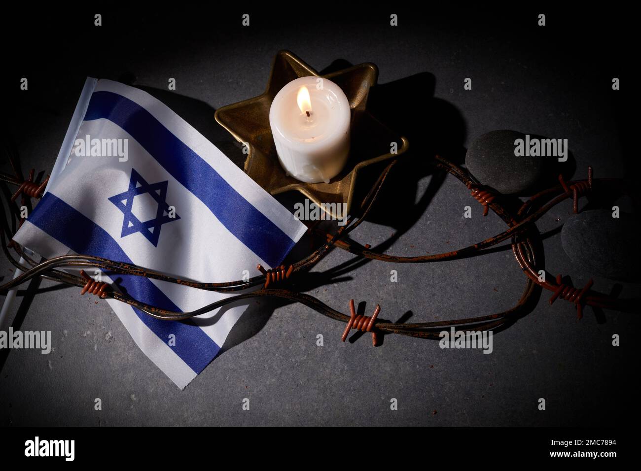 Burning candle, Barbed wire, flag of Israel on dark background ...