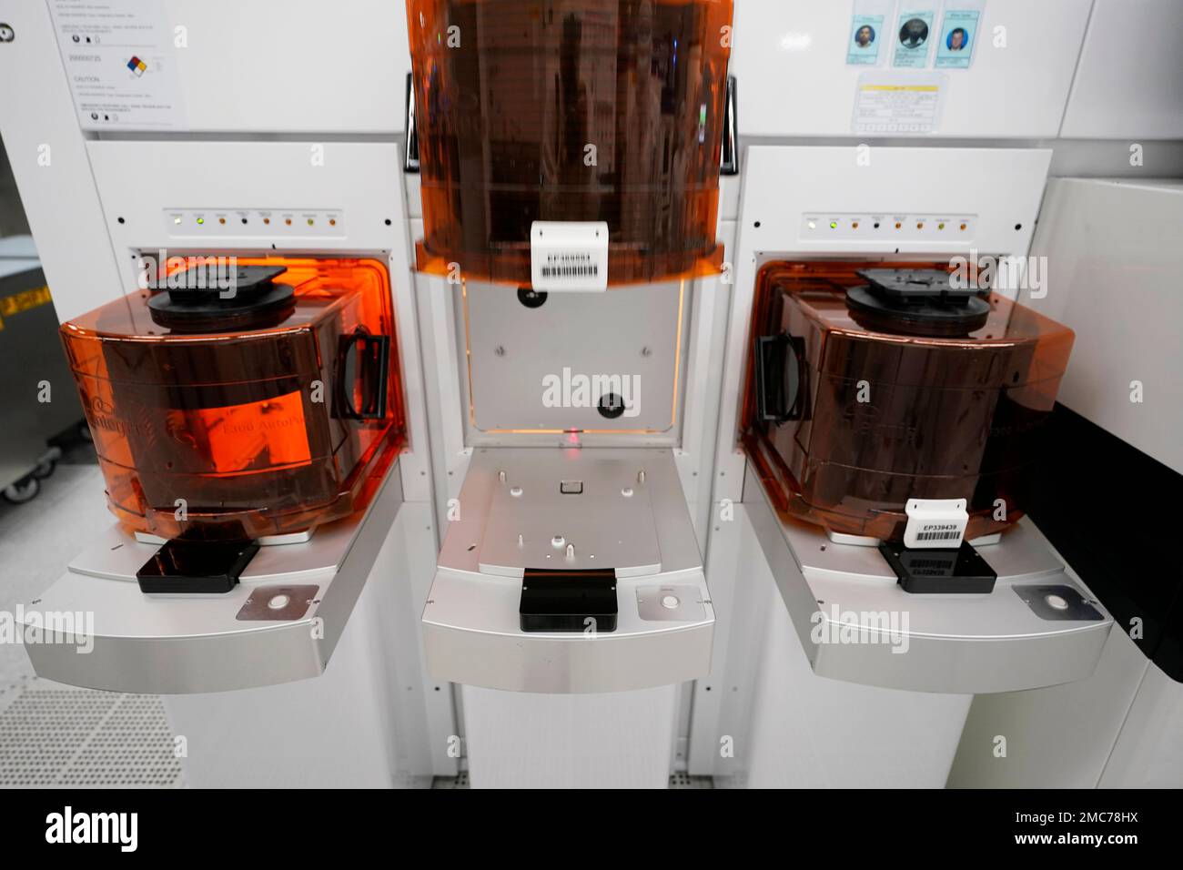 F.O.U.P. (Front Opening Unified Pod) of computer chip wafers are lifted ...