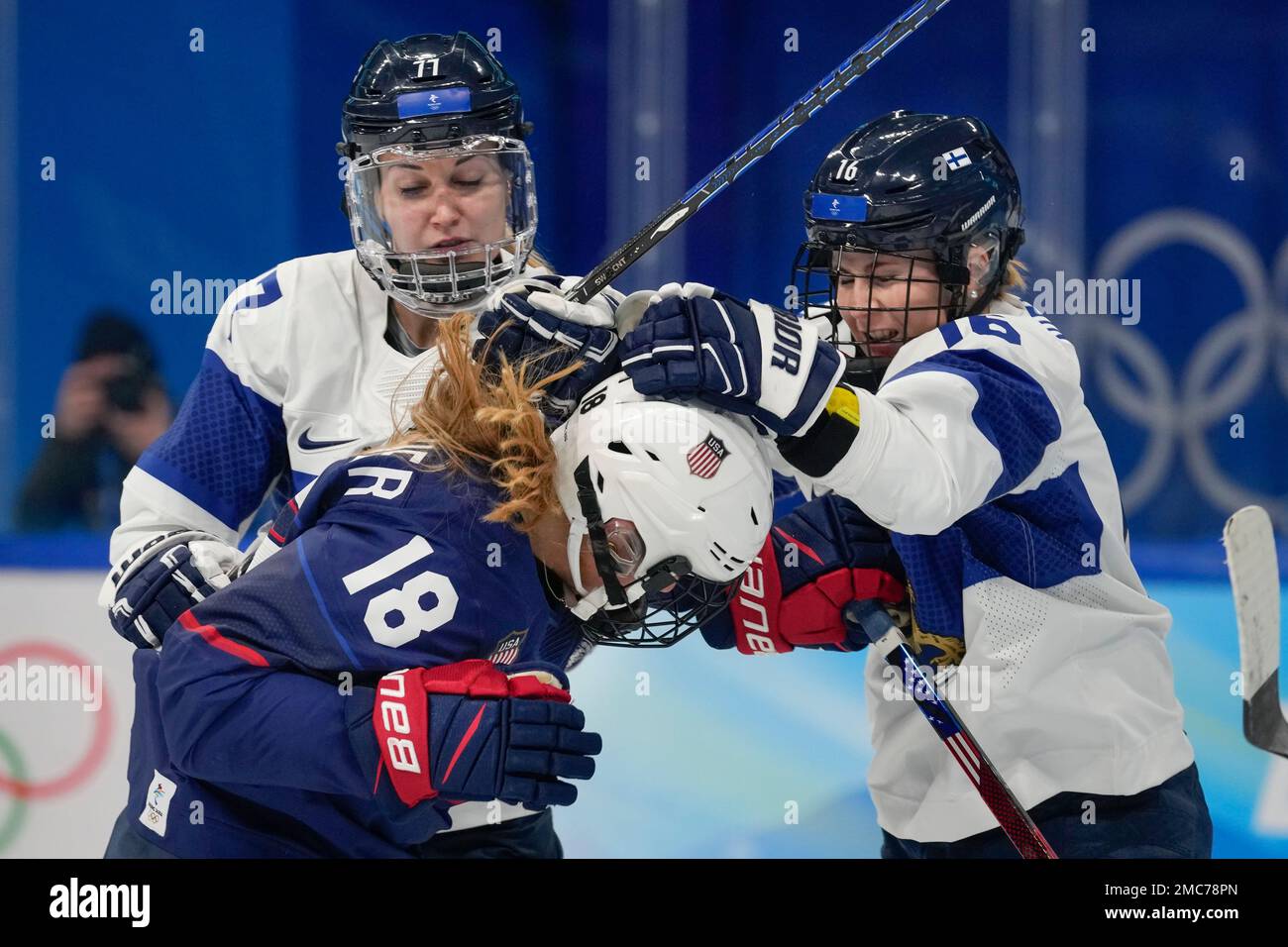 Finland's Susanna Tapani (77) and Petra Nieminen (16) scuffle with ...