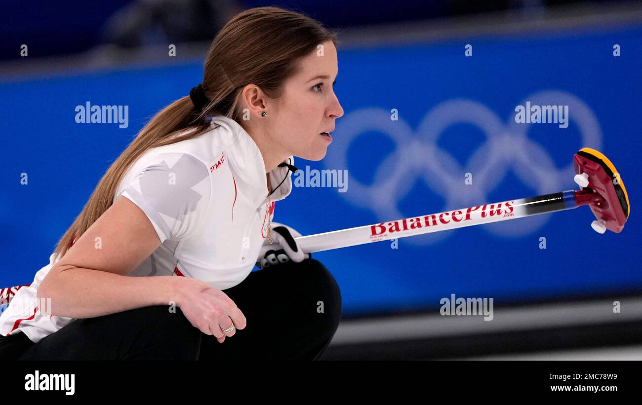 Canada's Kaitlyn Lawes, looks at her teammates after throwing a rock ...
