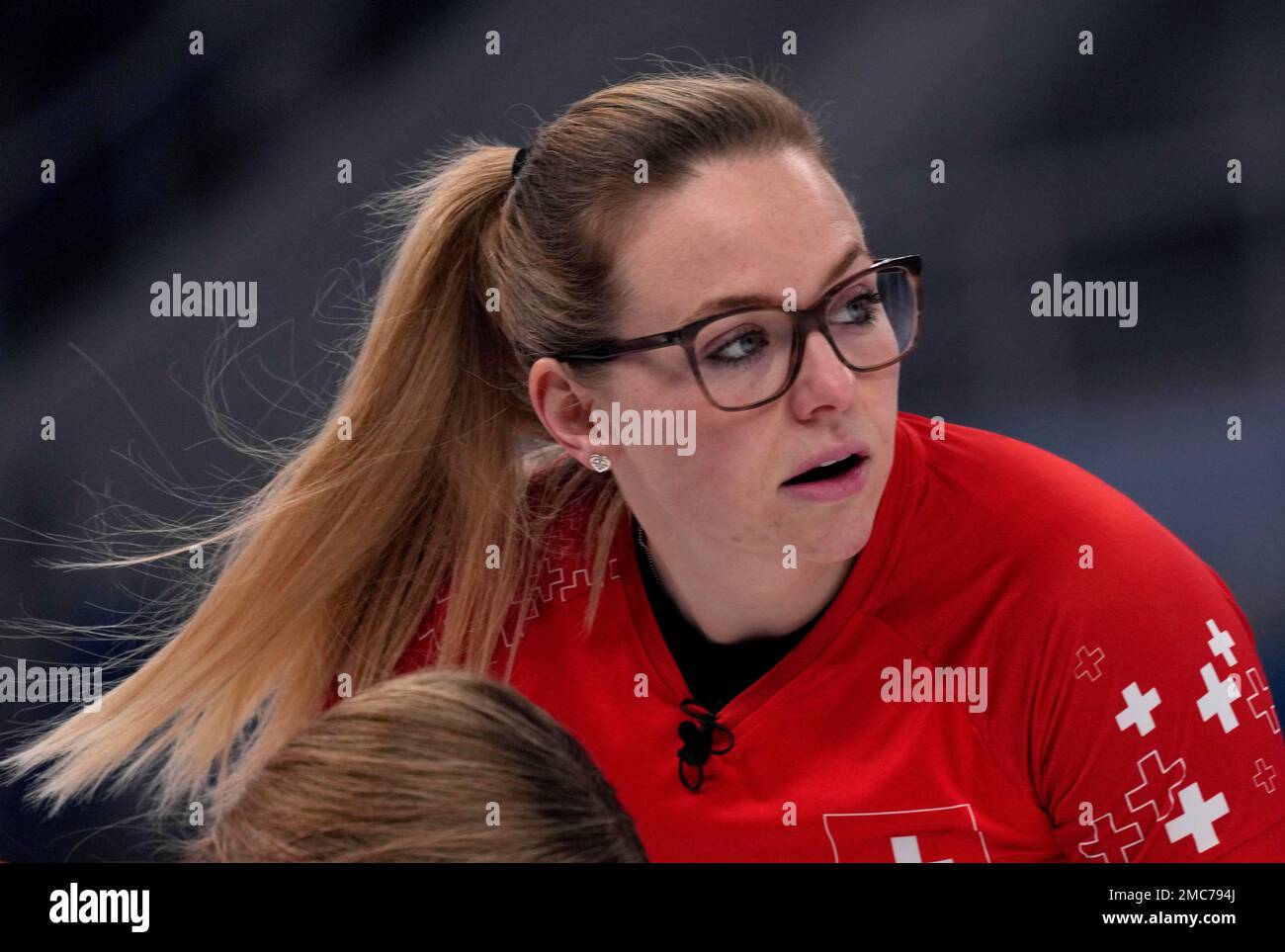 Switzerland's Alina Paetz, sweeps the ice, during the women's curling ...