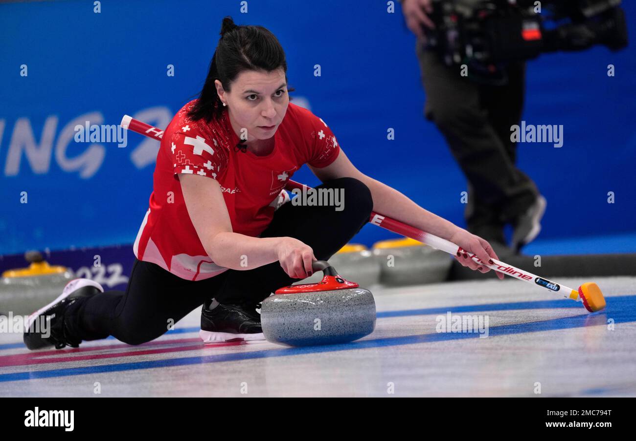 Switzerland's Esther Neuenschwander, throws a rock, during the women's ...