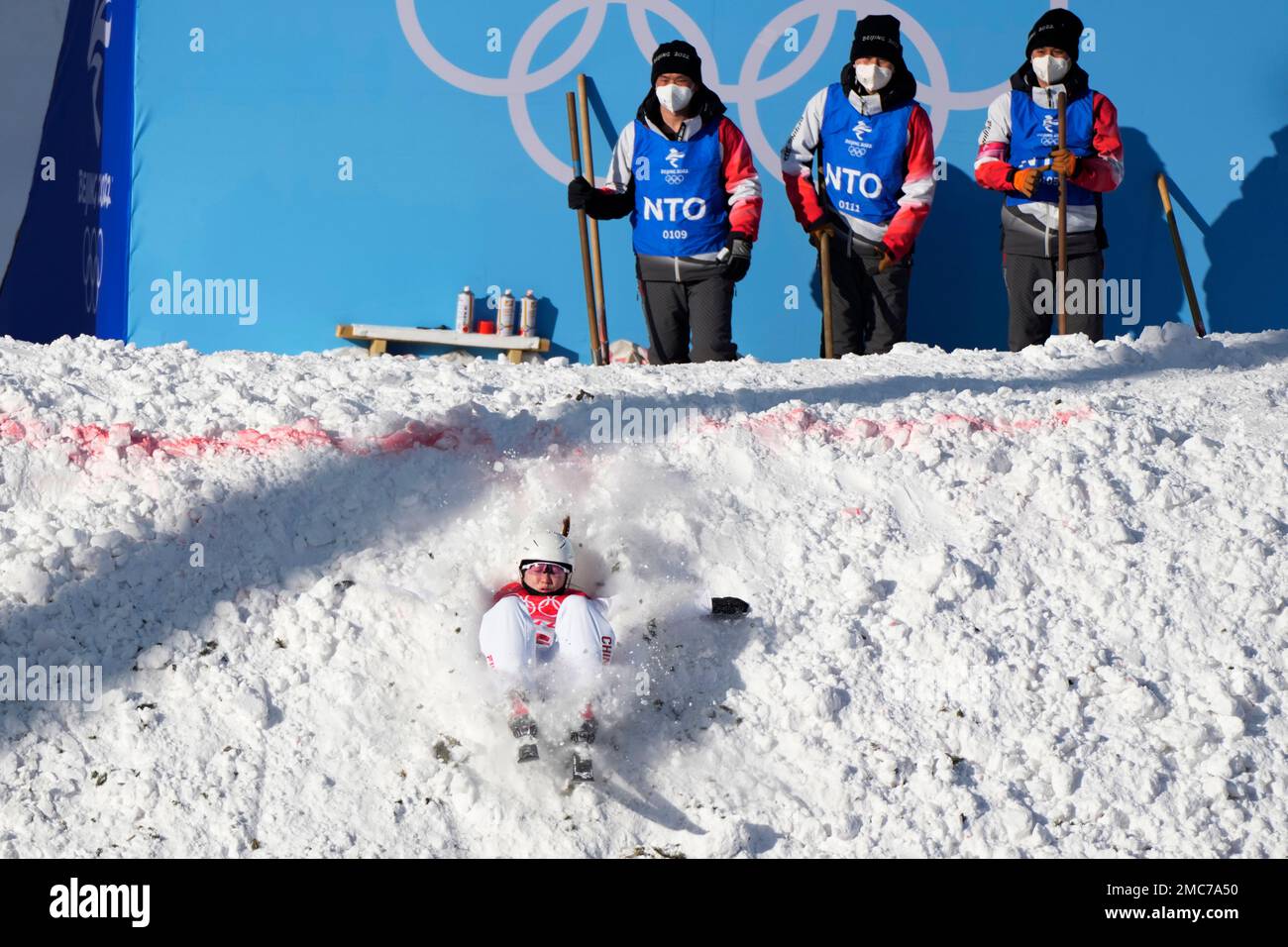 China's Shao Qi falls as she competes during the women's aerials ...