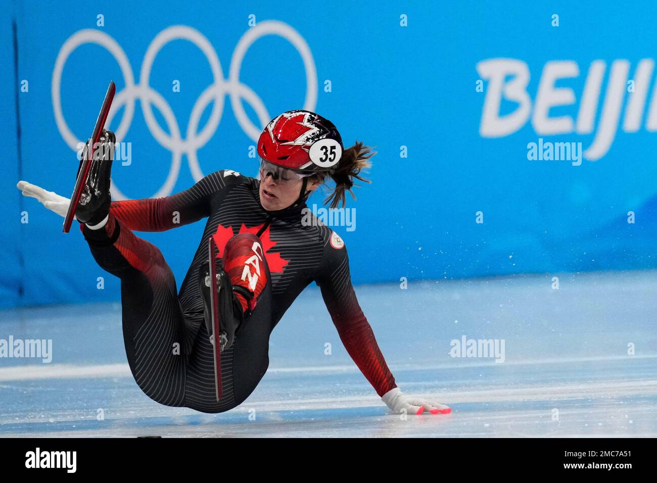 Kim Boutin of Canada, falls in her heat of the women's 1000-meters ...