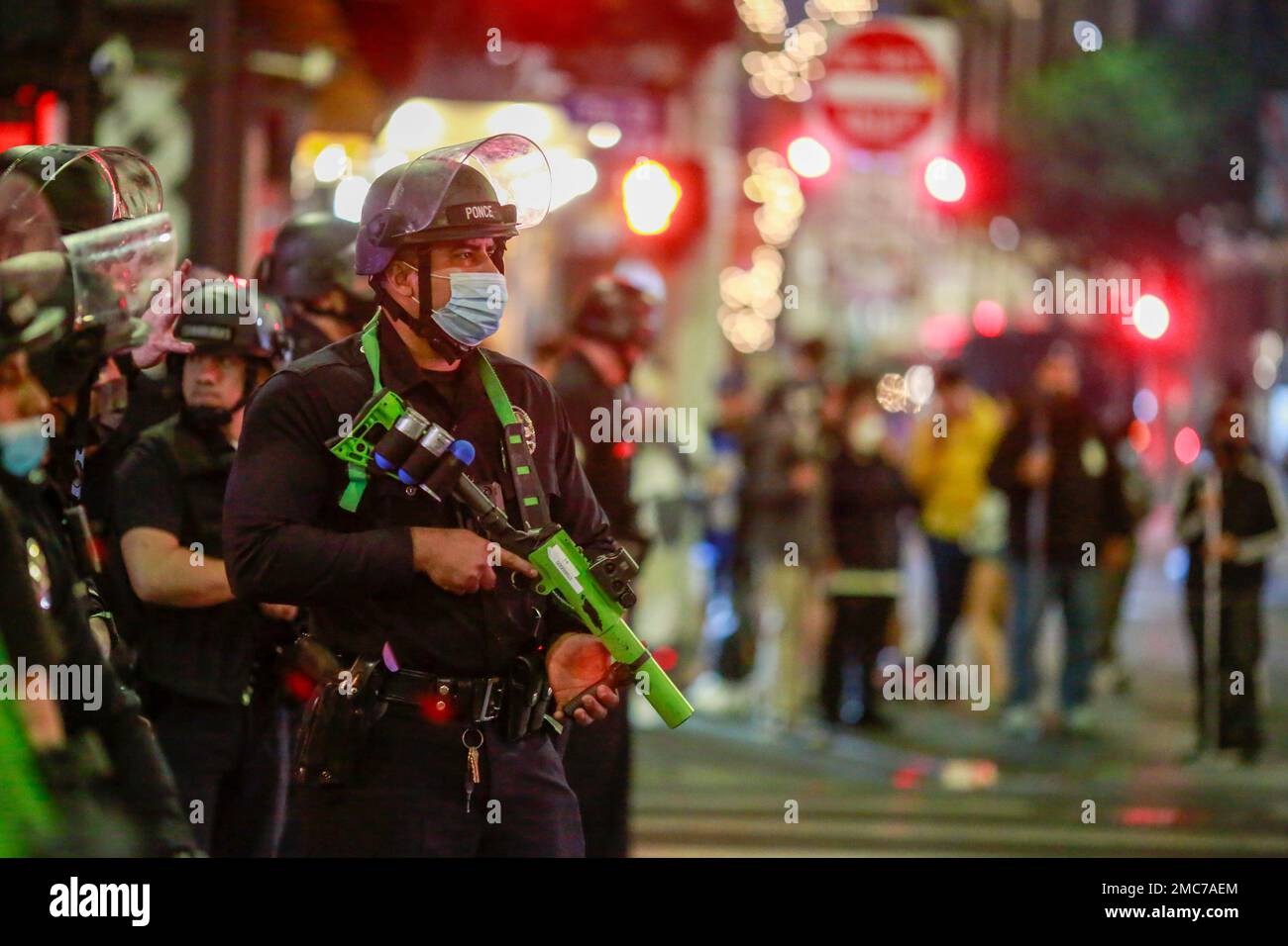 Riot police try to control a crowd on the street as football fans ...