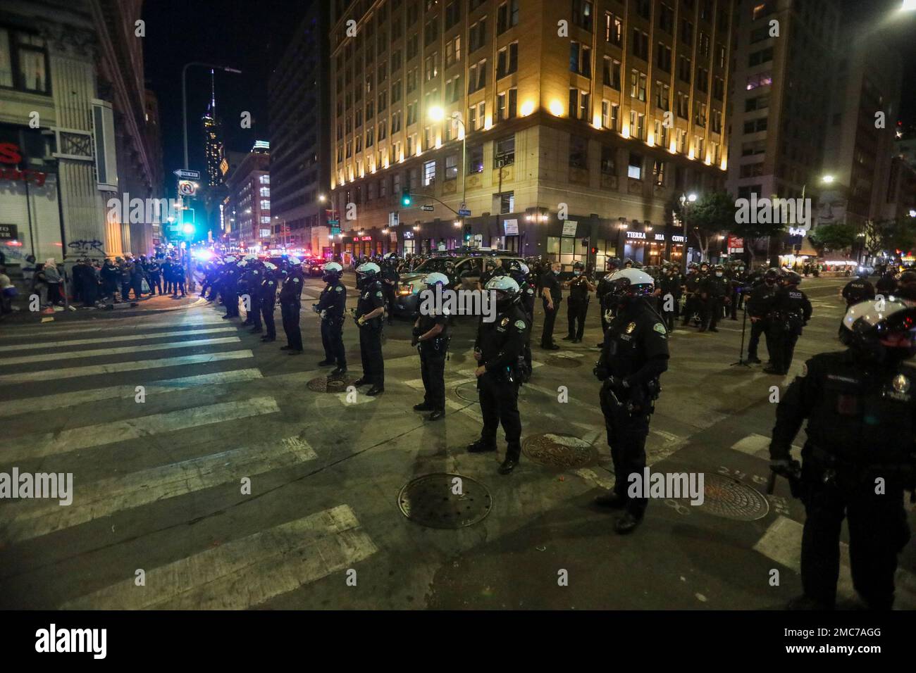 Riot police try to control a crowd on the street as football fans ...