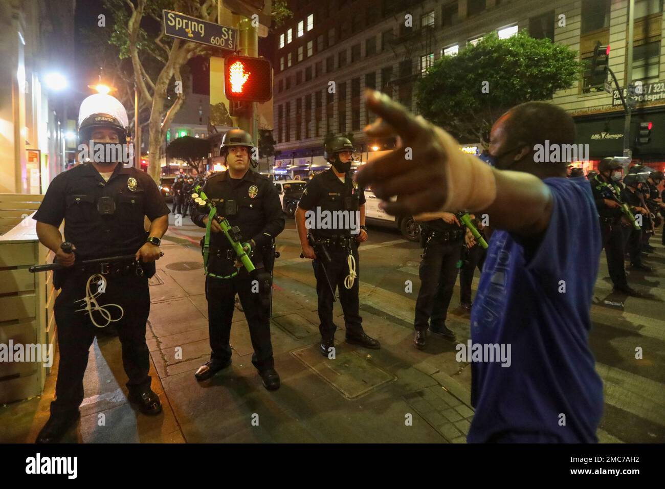 Riot police try to control a crowd on the street as football fans ...