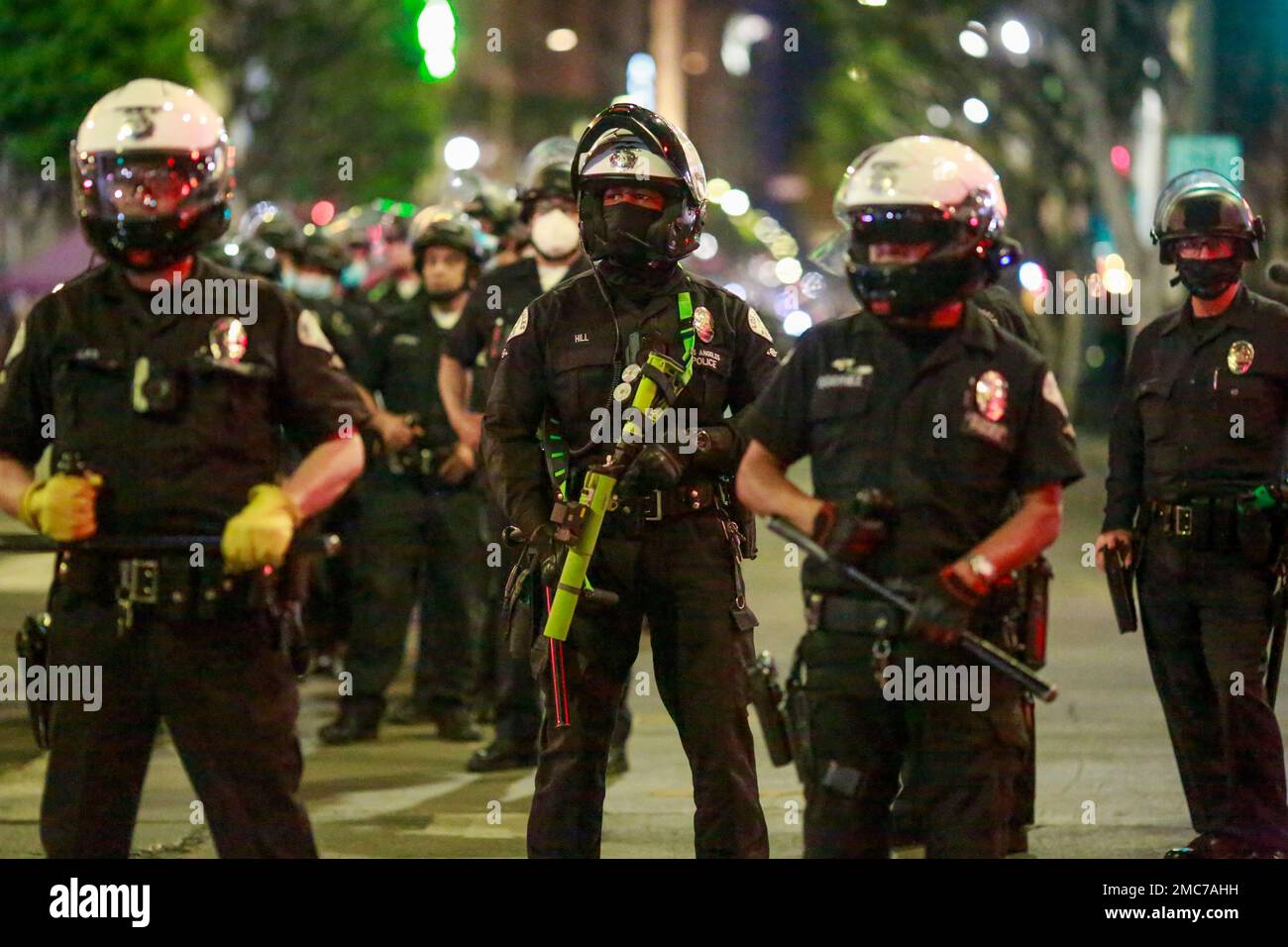 Riot police try to control a crowd on the street as football fans ...