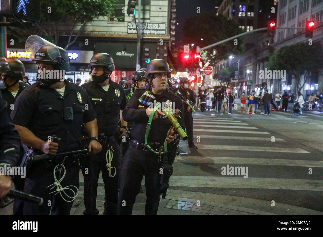 Riot police try to control a crowd on the street as football fans ...
