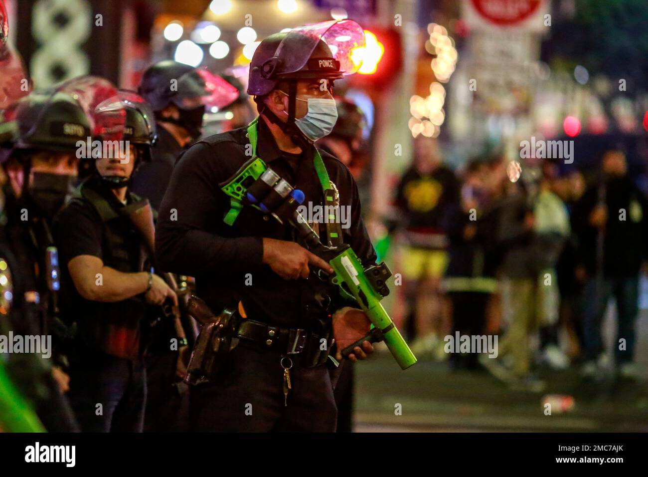 Riot police try to control a crowd on the street as football fans ...