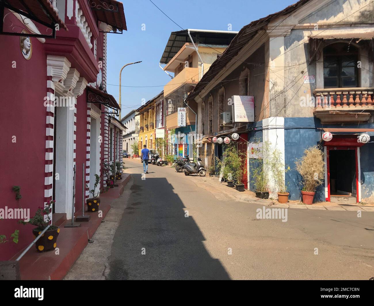 A man walks through a deserted street at Fontainhas, a UNESCO heritage ...