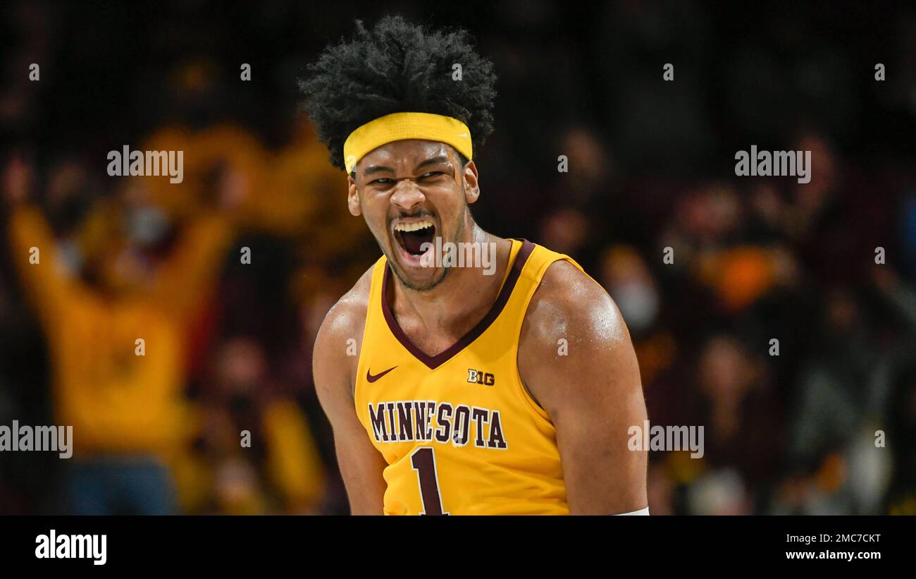 Minnesota forward Eric Curry (1) reacts after making a three point shot ...