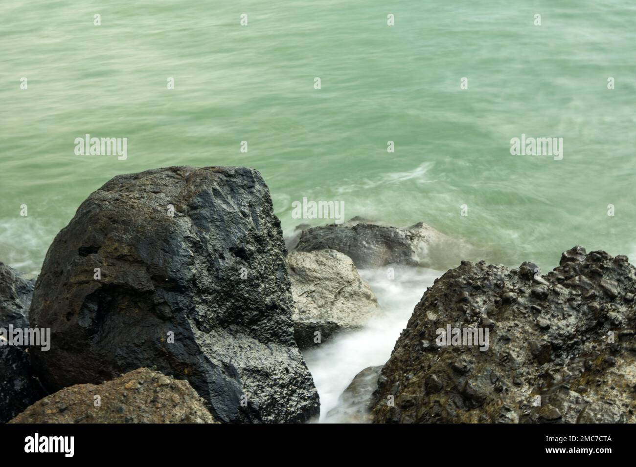Rocks on the Marina Beach Semarang. Indonesia Stock Photo - Alamy