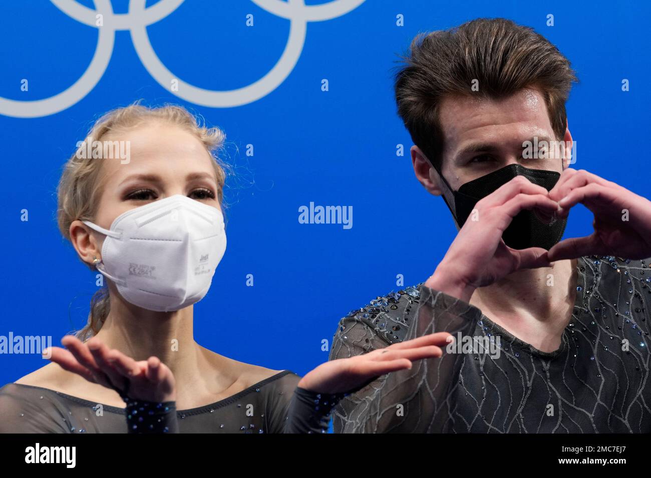Juulia Turkkila and Matthias Versluis, of Finland, react following ...