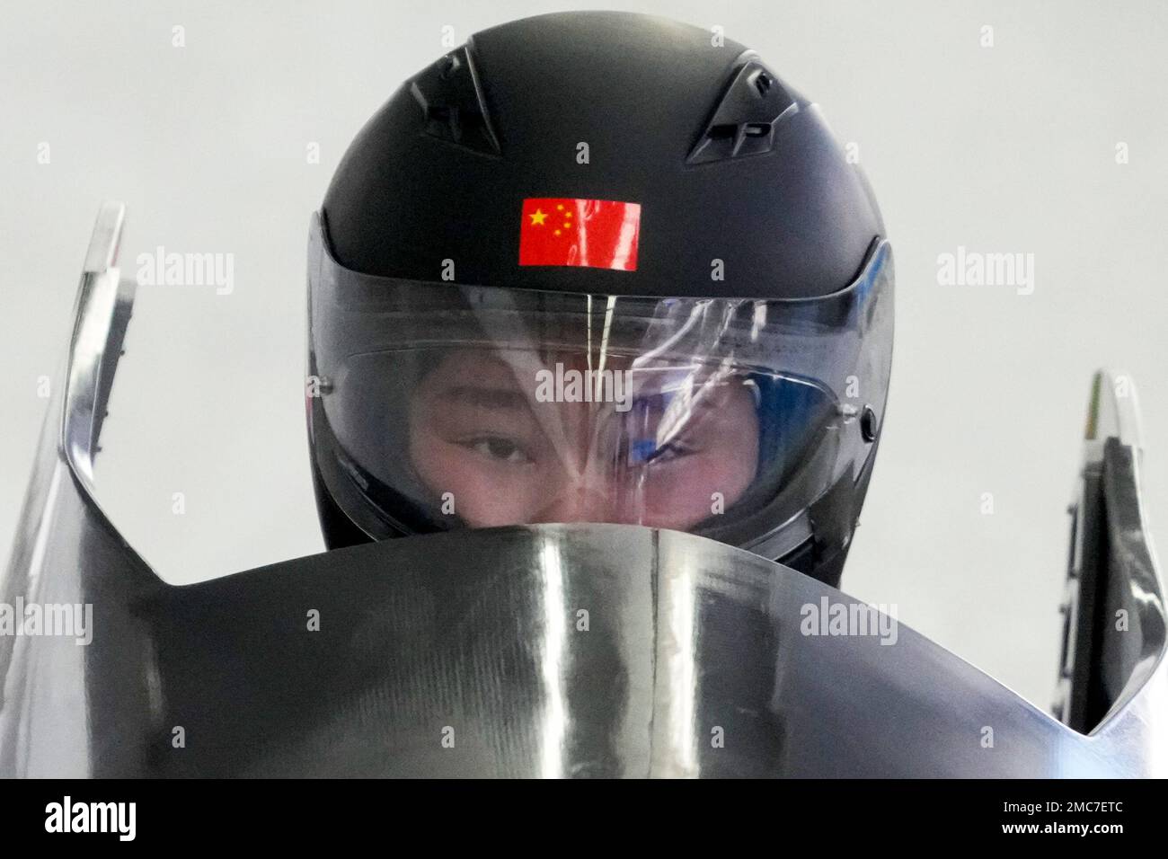 Ying Qing, of China, drives during the women's monobob heat 3 at the ...