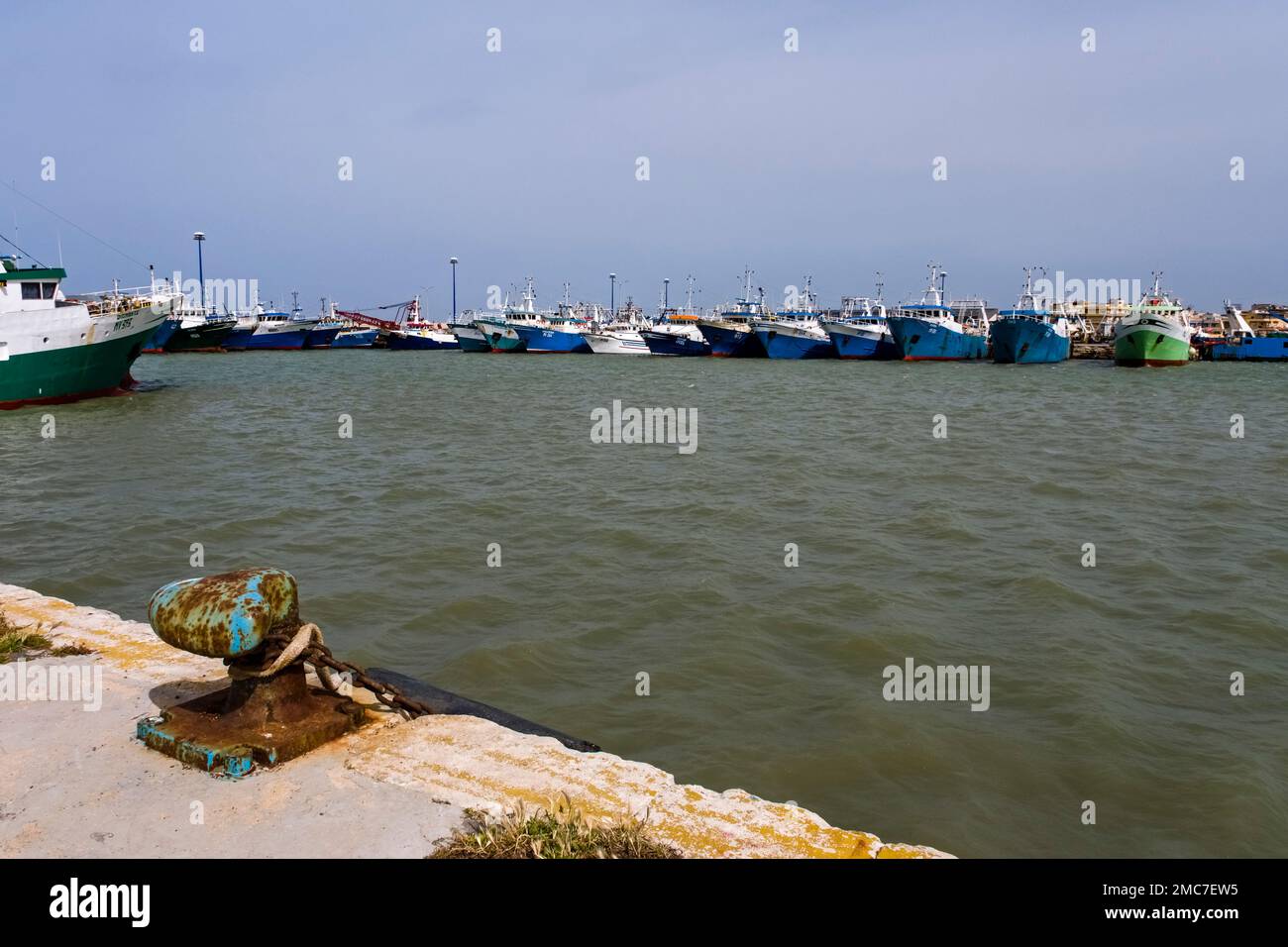 Colorful fishing boats are anchored in the harbour of Marsala, a major ...