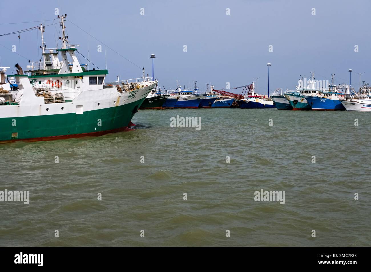 Colorful fishing boats are anchored in the harbour of Marsala, a major ...