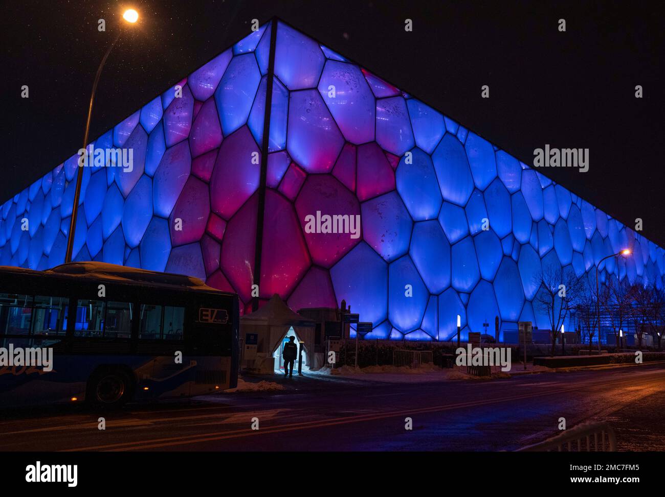 A security guards stands outside the curling venue, at the 2022 Winter ...